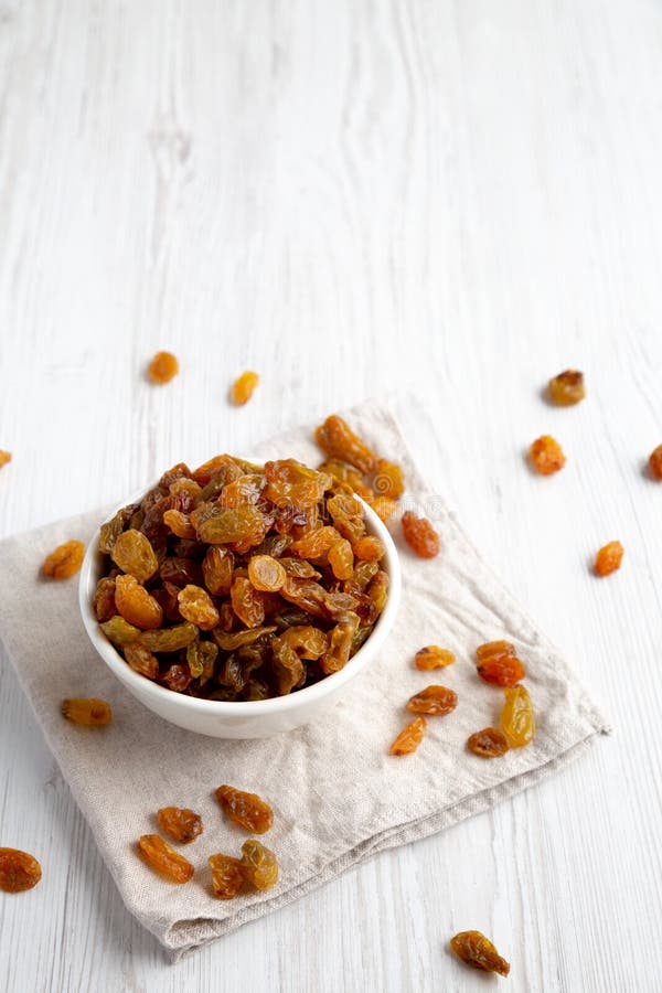 Organic Dried Raisins in a White Bowl, Side View. Space for Text Stock ...