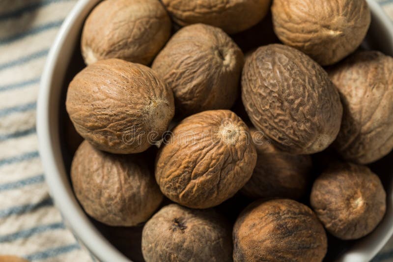Organic Dry Whole Nutmeg stock image. Image of delicious - 300798285
