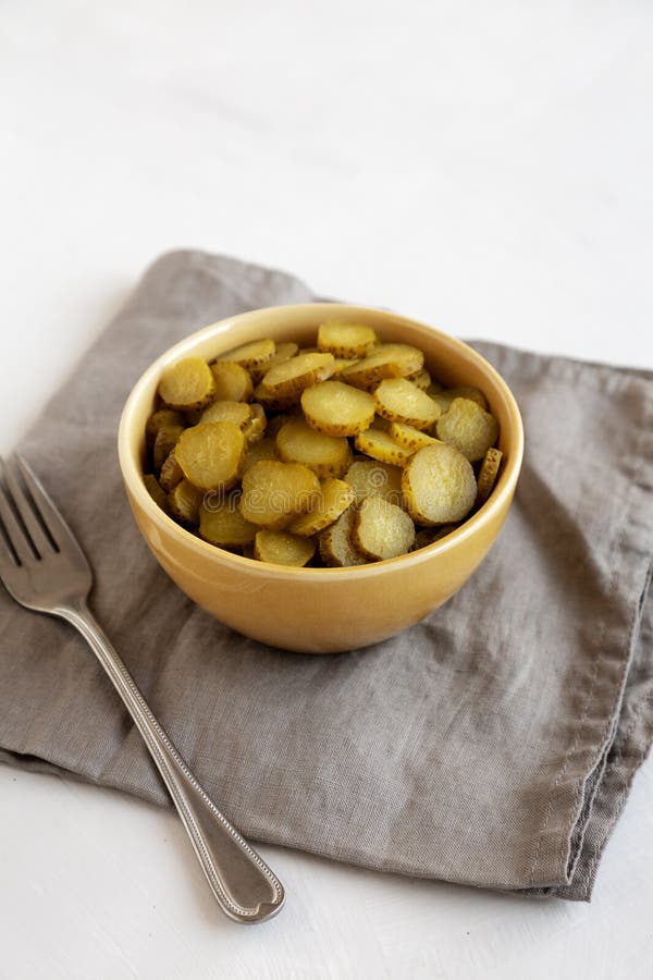 Organic Green Pickle Chips in a Bowl, Side View Stock Photo - Image of ...