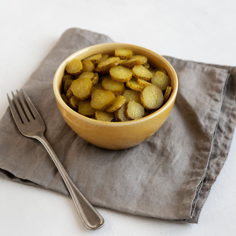 Organic Green Pickle Chips in a Bowl, Side View Stock Photo - Image of ...