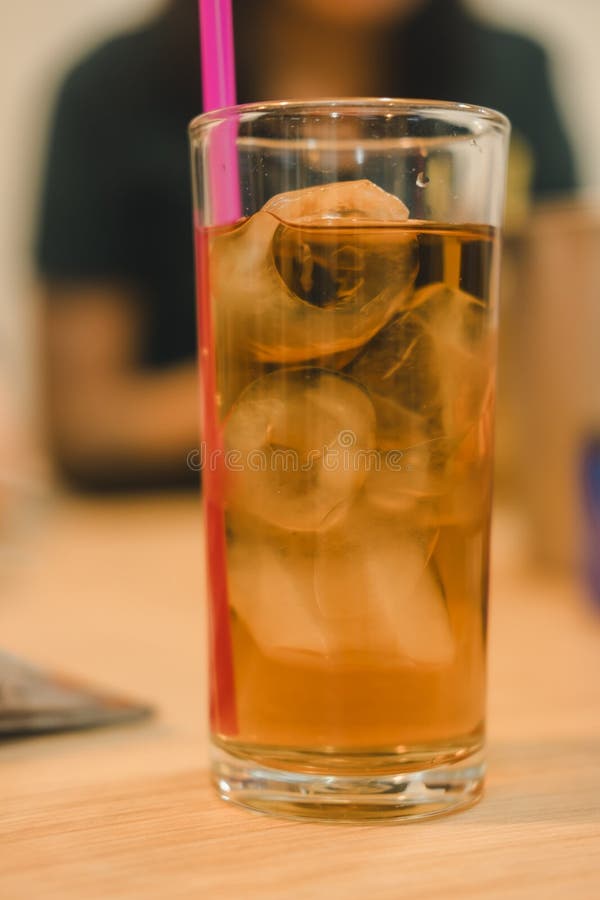Organic Iced Tea with Ice Cubes and Pink Straw Stock Image - Image of ...