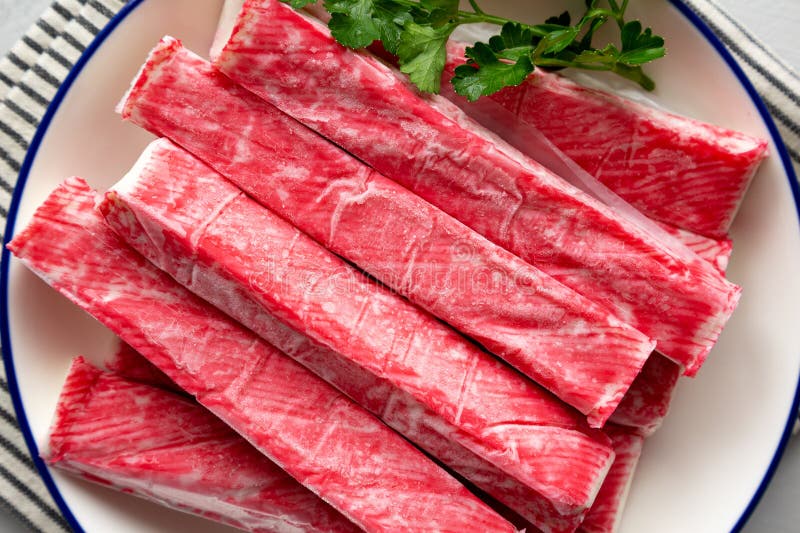 Organic Imitation Crab Meat Sticks on a Plate, Top View Stock Photo ...
