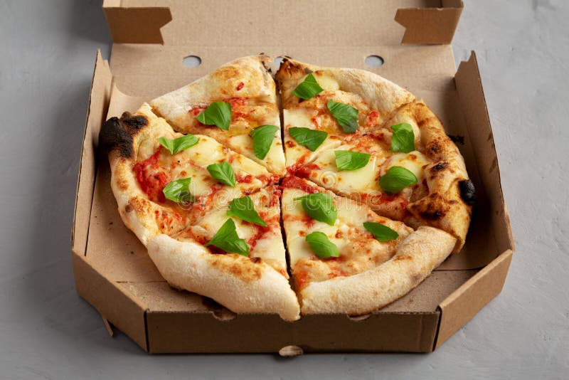 Organic Margarita Pizza with Basil and Mozarella in a Box, Low Angle ...