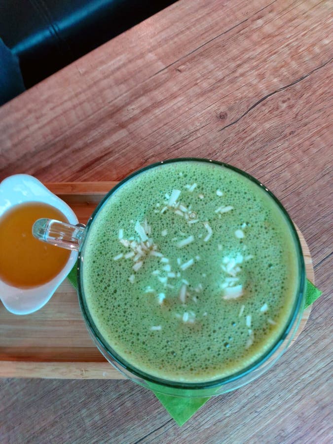 Organic Matcha Green Tea with White Chocolate on a Glass Cup. Stock ...