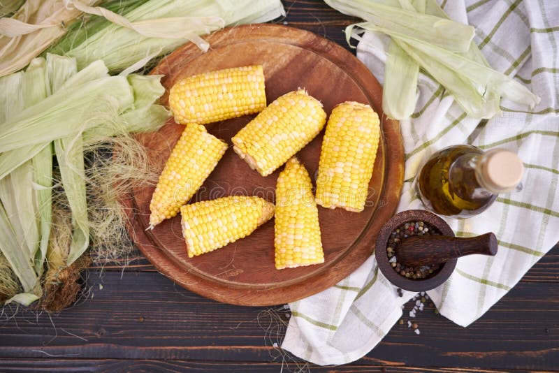 Organic Natural Corn Cobs on Wooden Kitchen Table Stock Image - Image ...