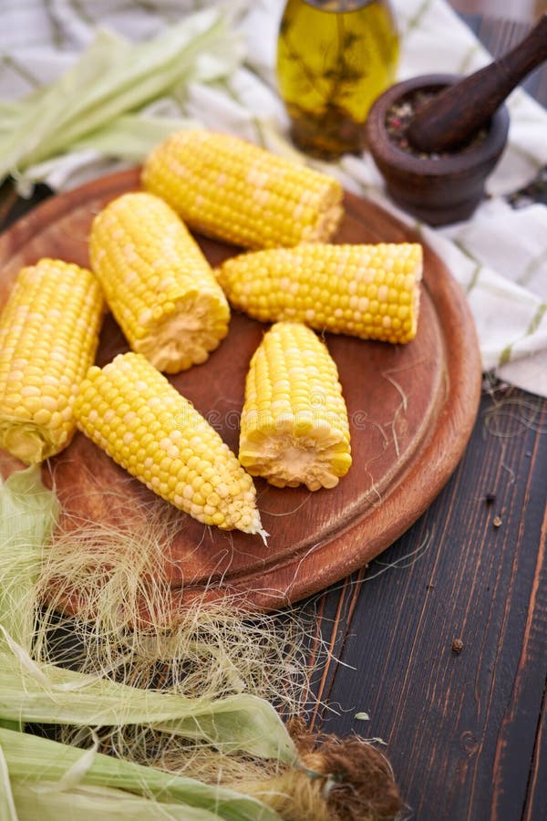 Organic Natural Corn Cobs on Wooden Kitchen Table Stock Photo - Image ...