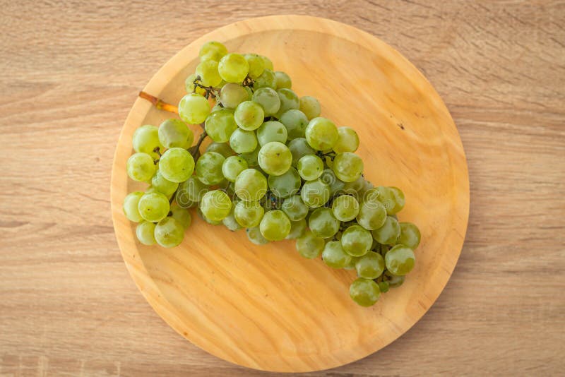 Natural Grapes on Wooden Plate Stock Photo - Image of fruit, organic ...