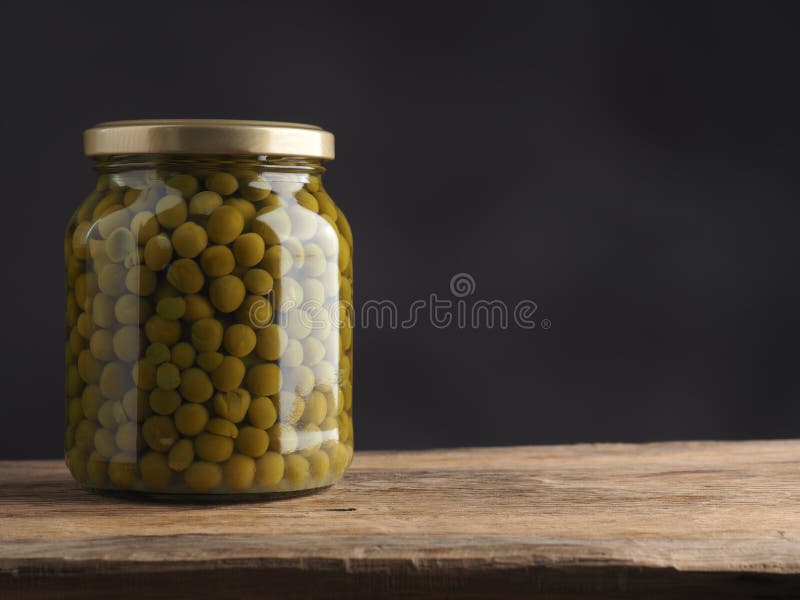 Organic peas in a jar stock photo. Image of cuisine - 149797034