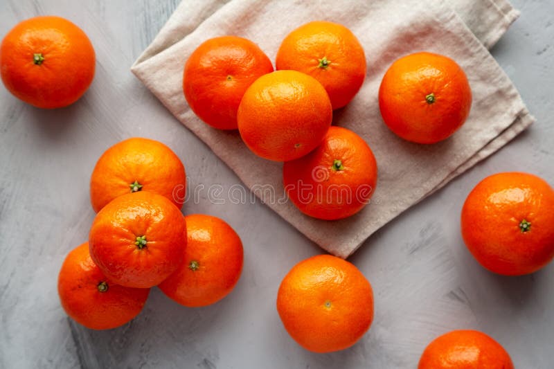 Organic Raw Mandarin Oranges on a Gray Background, Top View. Flat Lay ...