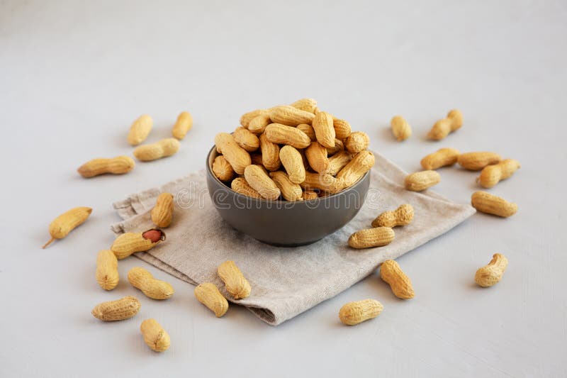 Organic Raw Peanuts in a Bowl, Side View Stock Photo - Image of food ...