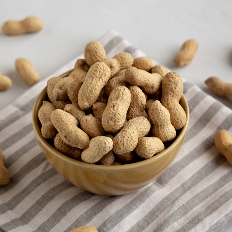 Organic Raw Peanuts in a Bowl, Side View Stock Photo - Image of pile ...