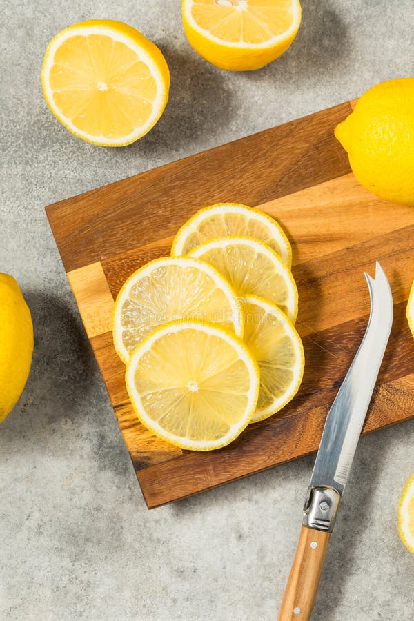 Organic Raw Yellow Sliced Lemons Stock Photo - Image of natural, juicy: 332003504
