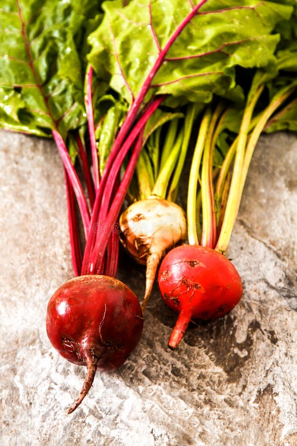 Organic Red Beets with Green Leaves on an Old Wooden Table. Rust Stock ...