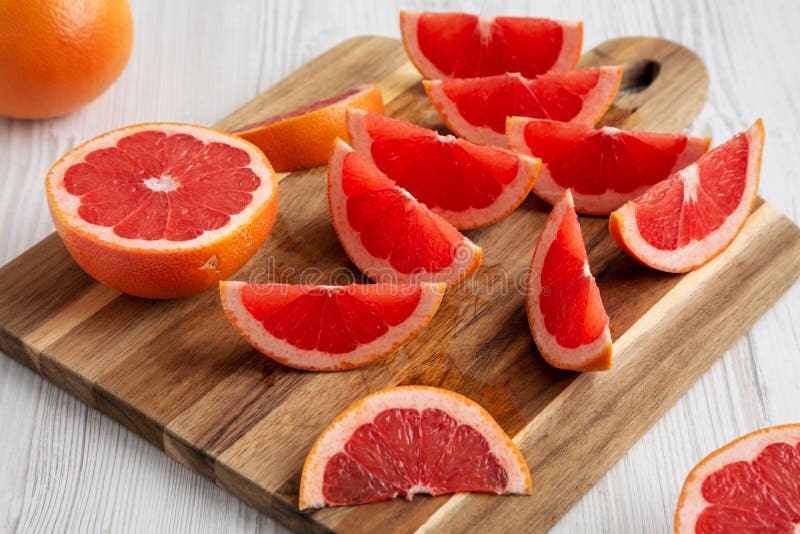 Organic Red Ruby Grapefruit on a Wooden Board, Side View Stock Photo ...