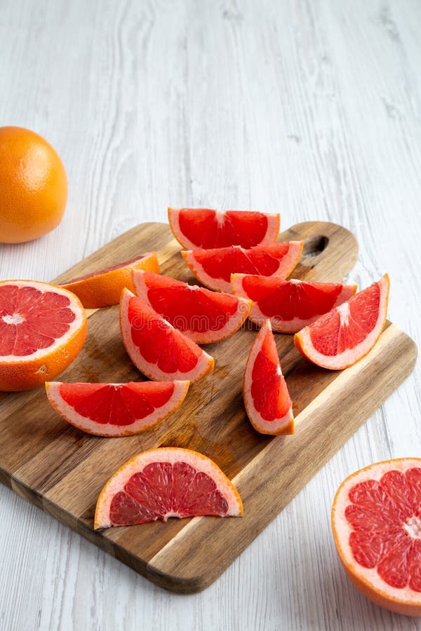 Organic Red Ruby Grapefruit on a Wooden Board, Side View. Space for ...