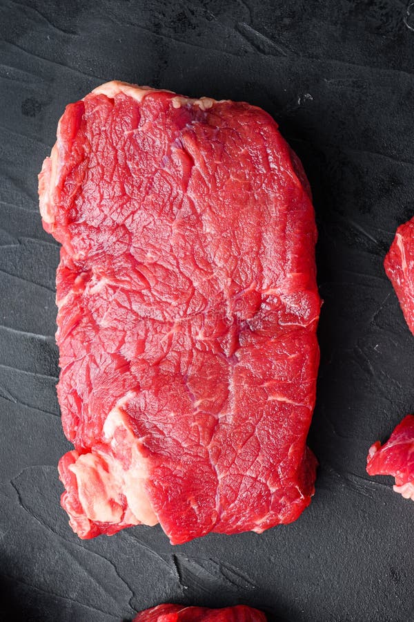 Organic Rump Beef Steaks, Top View on Black Textured Table Stock Photo ...