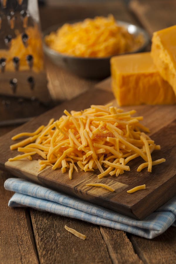 Organic Shredded Sharp Cheddar Cheese Stock Photo - Image of shredded ...
