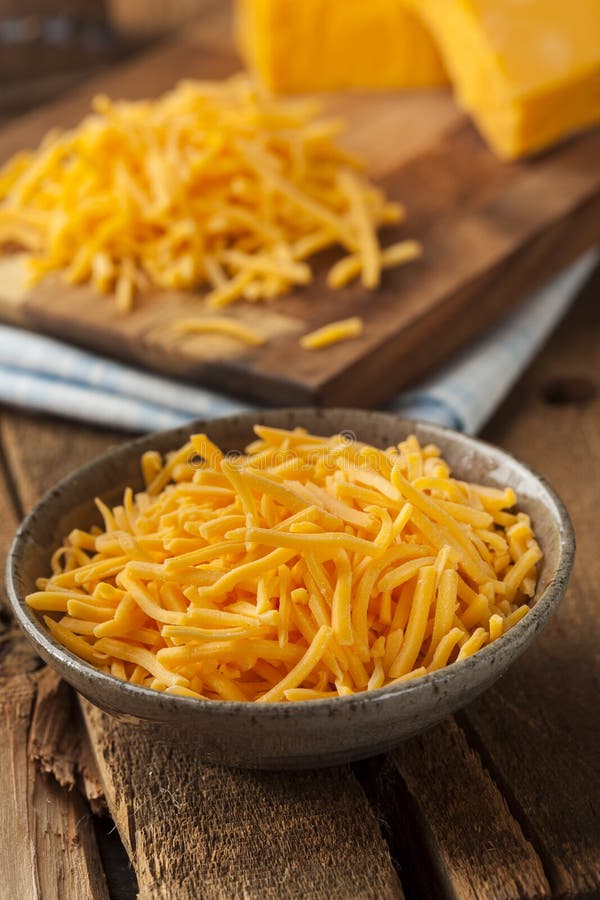 Organic Shredded Sharp Cheddar Cheese Stock Image - Image of wedge ...
