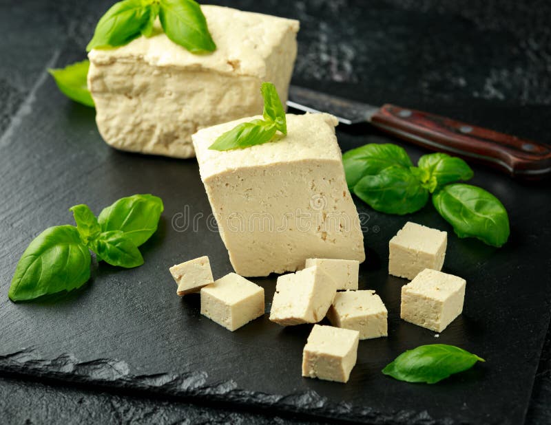 Organic Soy Tofu with Basil on Dark Rustic Stone Board Stock Image ...