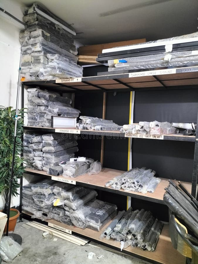 Organized Black Backwall Signage on a Rack in a Warehouse Stock Image ...