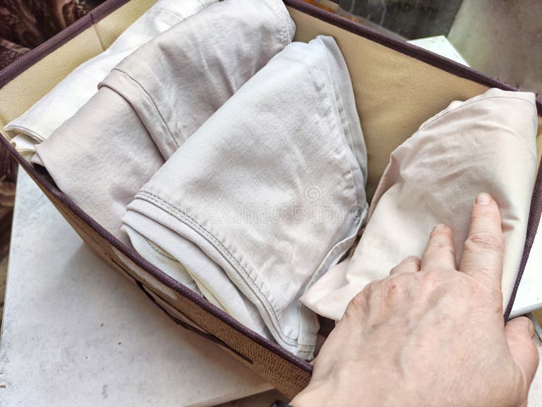 Organized Clothing Storage Using Konmari Folding Method. Neatly Folded ...