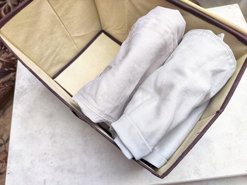 Organized Clothing Storage Using Konmari Folding Method. Neatly Folded ...