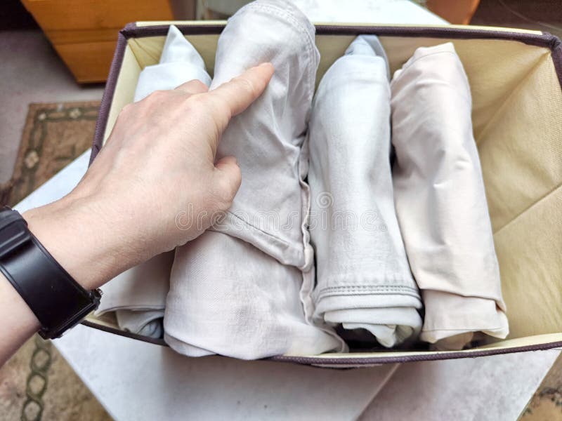 Organized Clothing Storage Using Konmari Folding Method. Neatly Folded ...