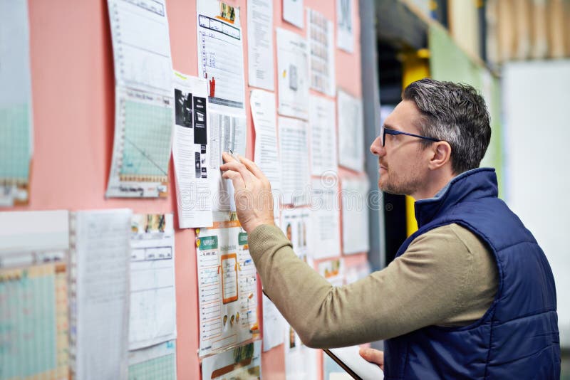 Organized and Efficient. a Man Working in a Large Warehouse. Stock ...