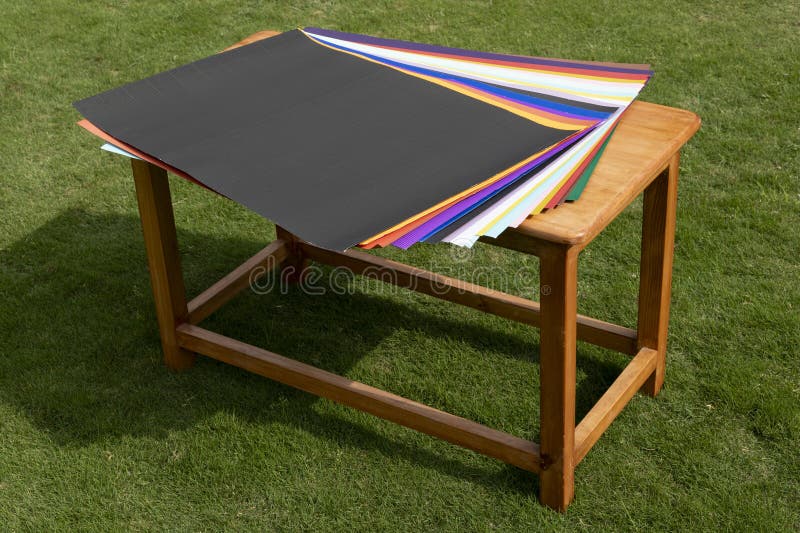 Organized Stack of Colored Chart Sheets on Wooden Table for DIY and ...