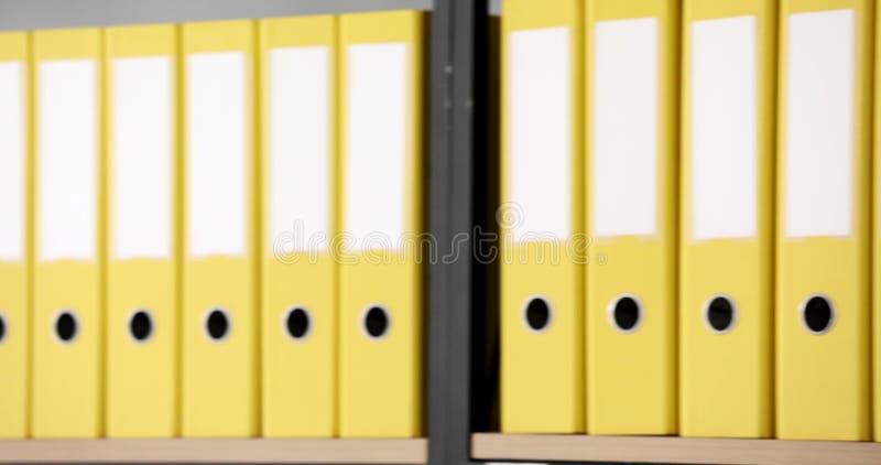 Organized Structure of Yellow Ring Binders Put on Shelves Stock Footage ...