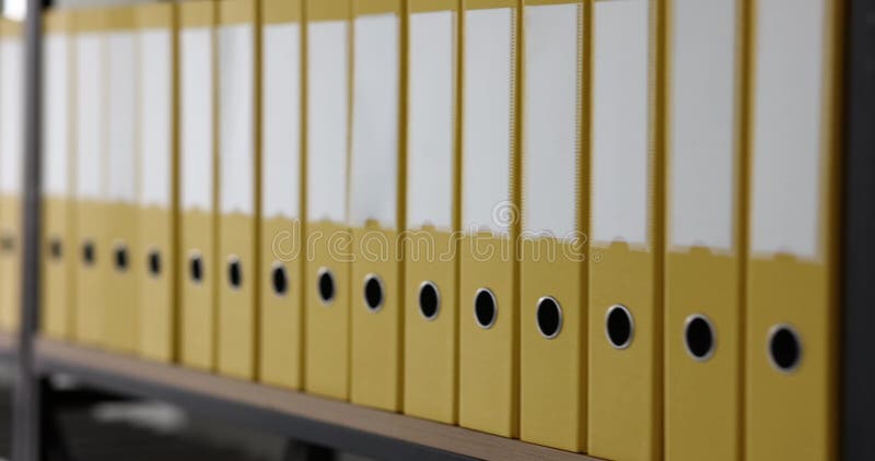 Organized Structure of Yellow Ring Binders on Shelves Stock Video ...