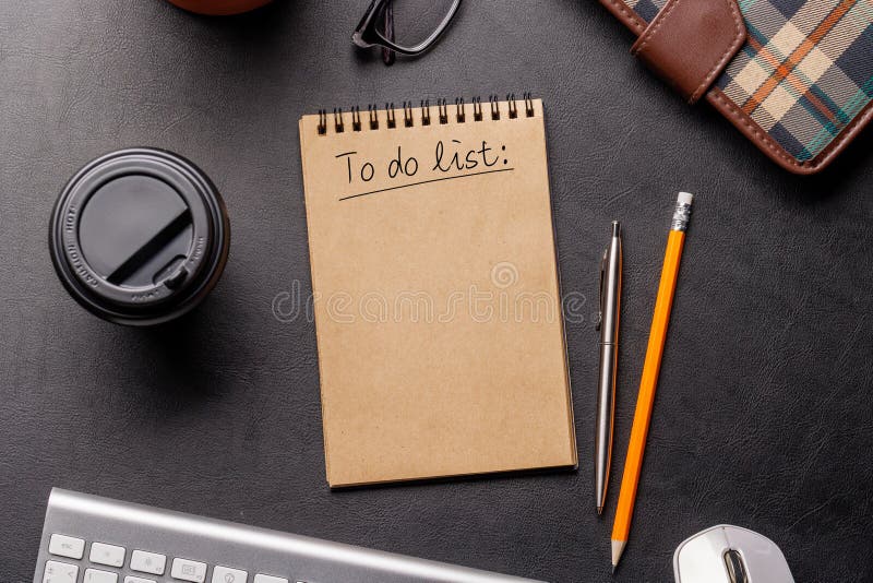 Organized Work Desk Setup with PC, Office Supplies, Coffee, and a ...