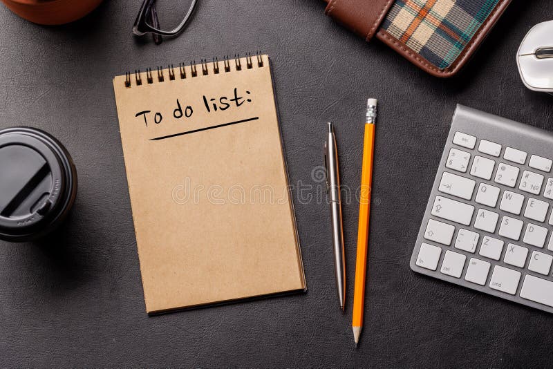 Organized Work Desk Setup with PC, Office Supplies, Coffee, and a ...