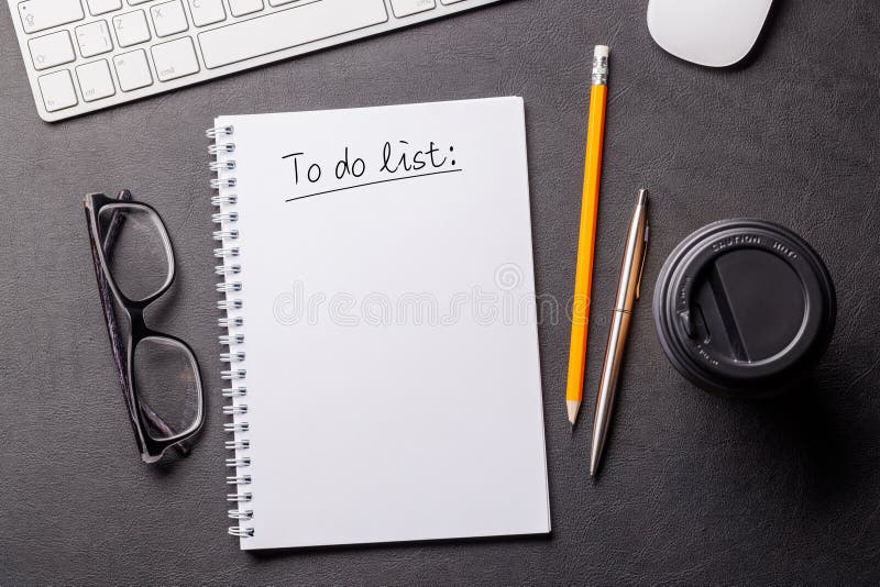 Organized Work Desk Setup with PC, Office Supplies, Coffee, and a ...