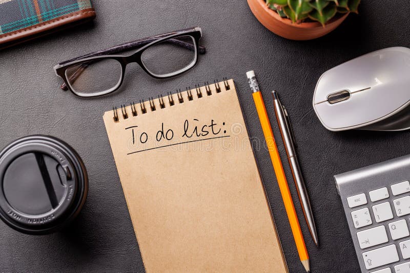 Organized Work Desk Setup with PC, Office Supplies, Coffee, and a ...