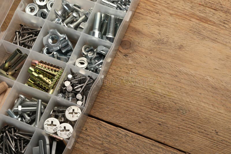 Organizer with Many Different Fasteners on Wooden Table, Above View ...