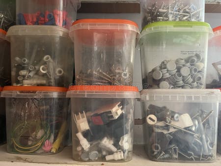 Organizing Assorted Hardware Items in Clear Storage Containers on a ...