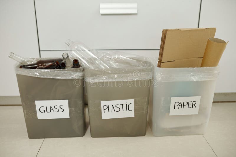 Organizing Recycling Bins for Glass Plastic and Paper Waste Stock Image ...
