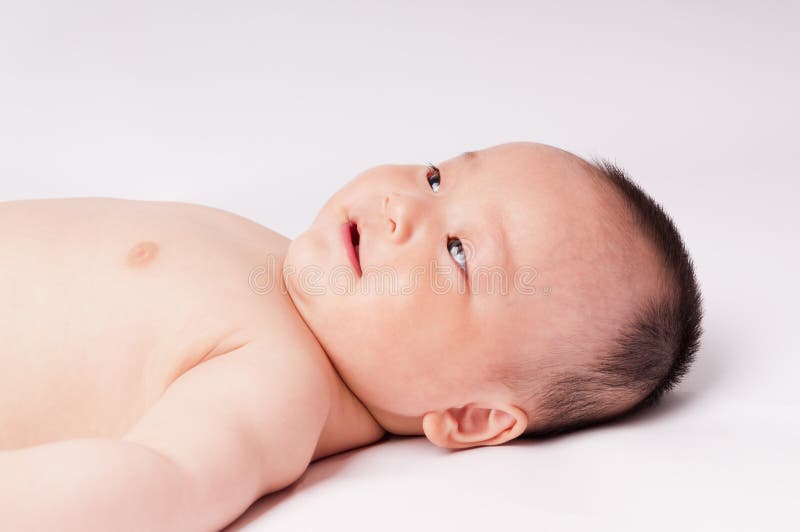 Oriental baby lying down stock photo. Image of childhood - 40875542