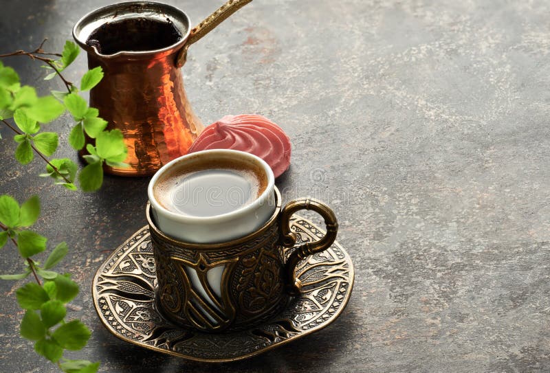 Oriental Coffee Cooked in Traditional Turkish Copper Coffee Pot Poured ...