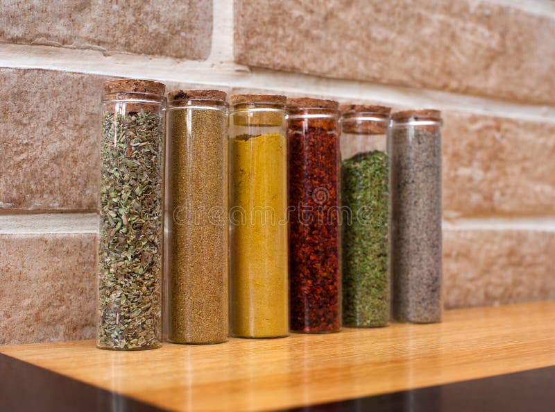 Oriental Spices in Row of Glass Container, Tubes Stock Image - Image of ...