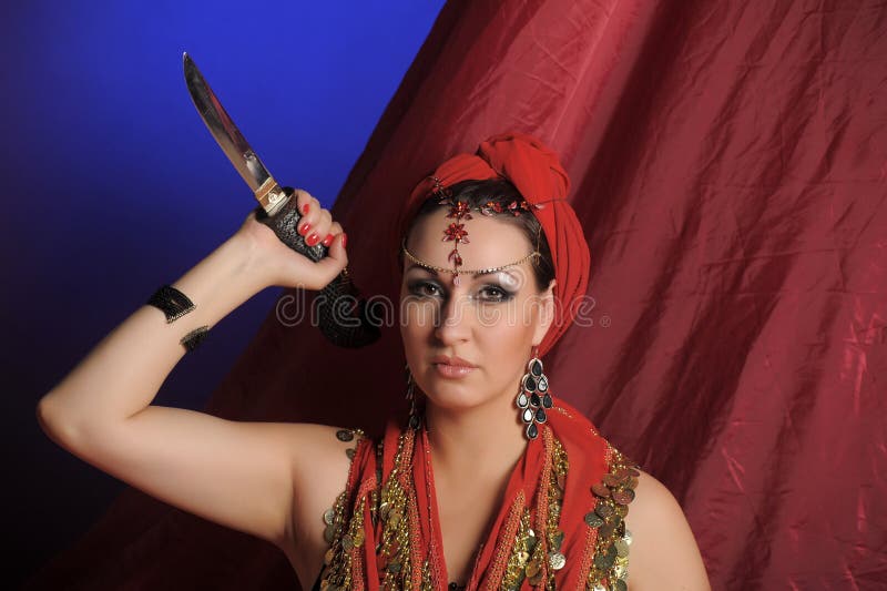 Oriental Woman in Red with a Knife Stock Image - Image of diwali, dress ...