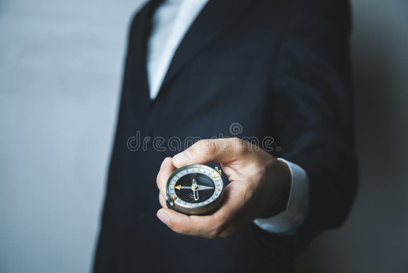 Orientation Concept- analogic compass on man hand