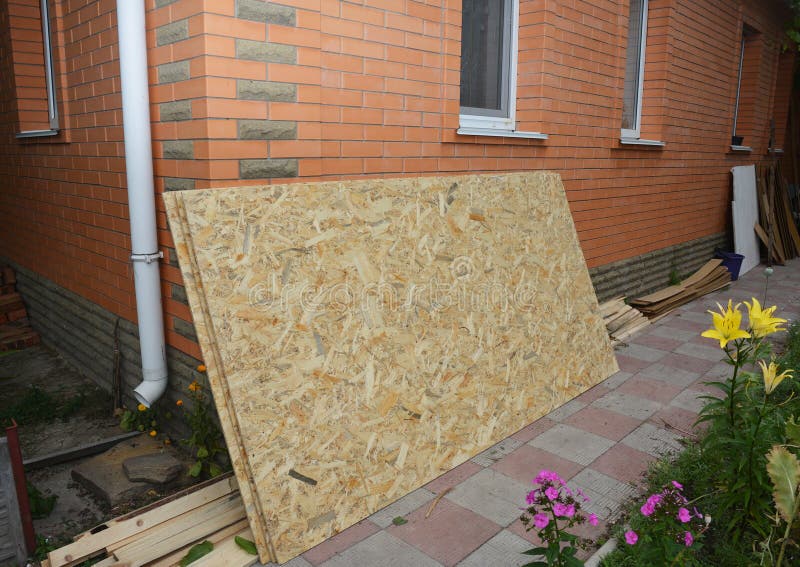 Oriented Strand Board OSB Near Brick House Wall Stock Photo - Image of ...