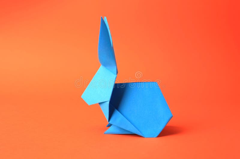 Origami Art. Beautiful Paper Rabbit on Orange Background Stock Photo ...