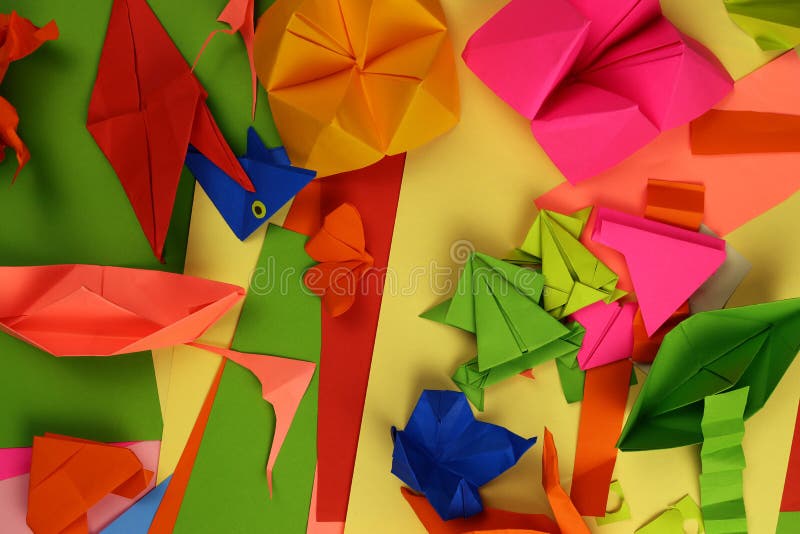 Origami Crafts on Colored Sheets of Paper Stock Photo - Image of person ...