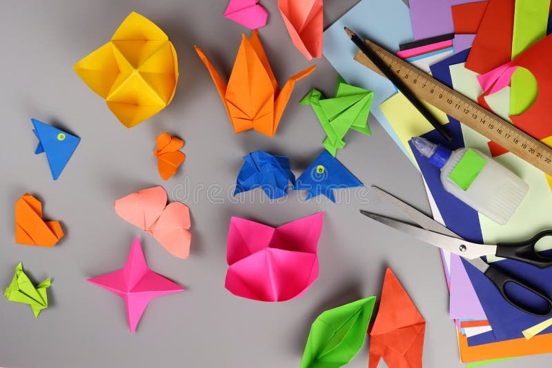 Origami Crafts Made of Colored Paper on a Gray Table Stock Image ...
