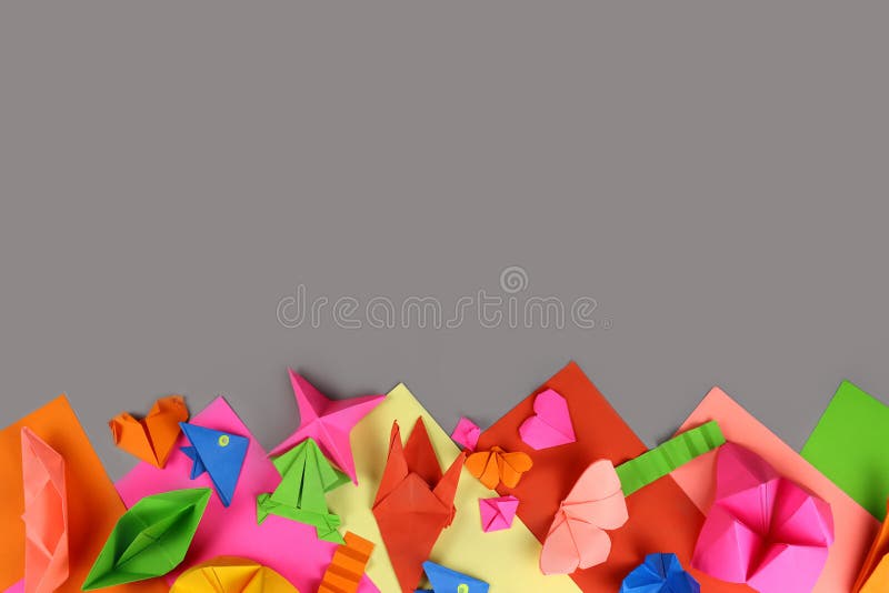 Origami Crafts Out of Paper on a Gray Table. Copy Space for Text Stock ...