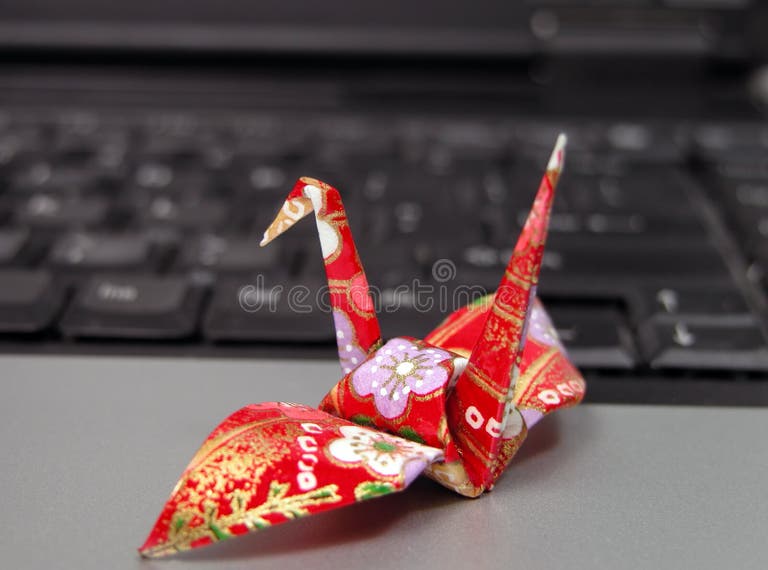 Origami on laptop stock image. Image of tradition, crane - 597713