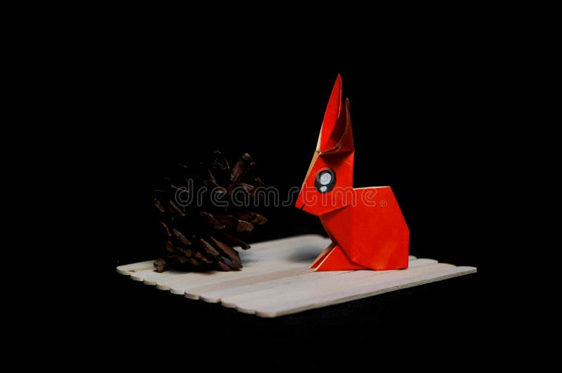 Origami of Red Rabbit and Pincone on Ice Cream Stick Stock Photo ...
